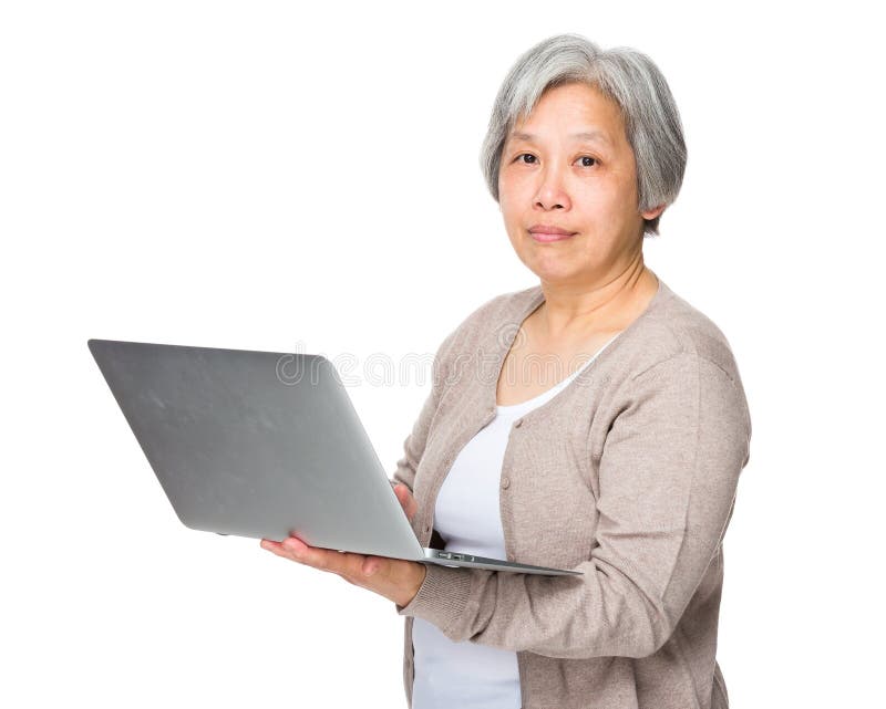 Old woman use of laptop stock image. Image of house, knitwear - 52540677