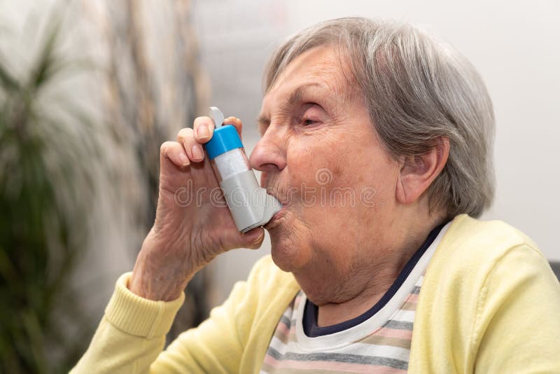 Old Woman Using an Asthma Inhaler Stock Photo - Image of breath ...