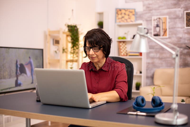 Old Woman Using a Modern Computer in Her Living Room Stock Photo ...