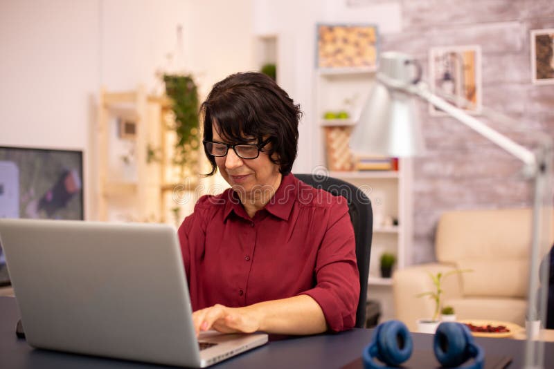 Old Woman Using a Modern Computer in Her Living Room Stock Photo ...