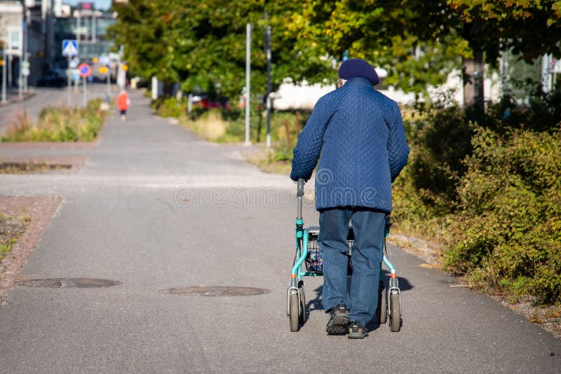Old Woman Walking with a Walker Stock Photo - Image of aged, woman ...