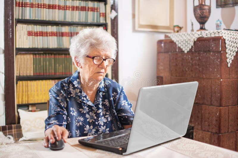 Old Woman Working on Laptop Computer at Home. Stock Image - Image of ...
