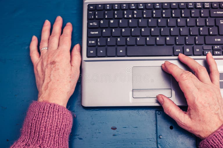 Old Woman Working on Laptop Computer at Home Stock Photo - Image of ...