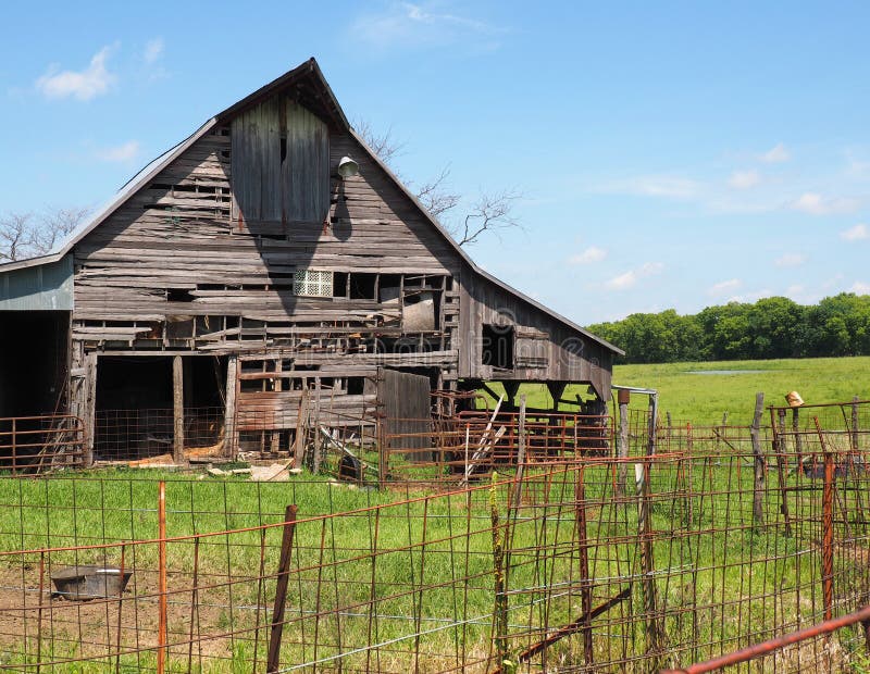 Old Wood Barn by a Rusty Fence Stock Photo - Image of fence, farm: 59232084