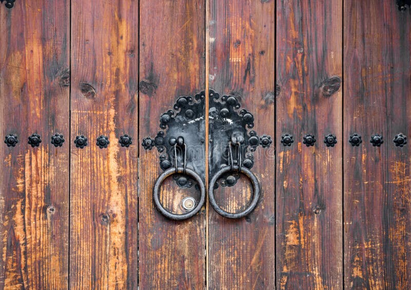 Old Wood Door with Metal Rings Stock Image - Image of handle, closeup ...