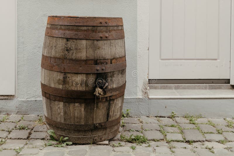 An Old Wooden Barrel in Front of a House Wall in the City Stock Image ...