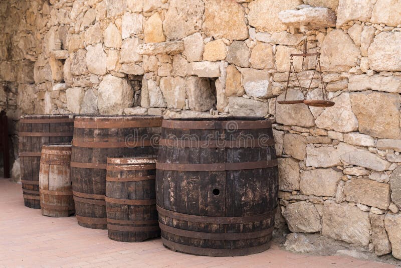 Old Wooden Barrels on Stones Wall Texture Background Stock Image ...