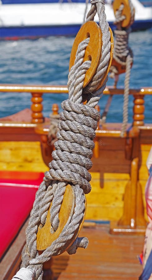 Old wooden block with rope stock photo. Image of equipment - 232225844