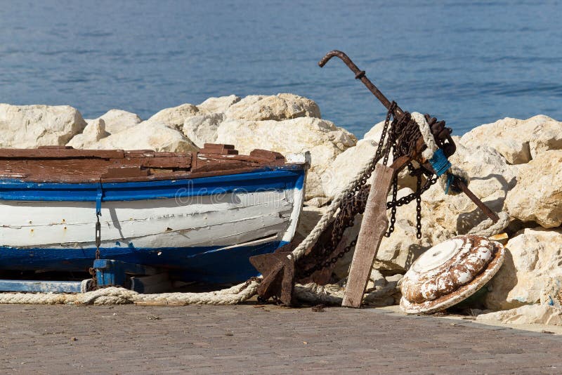 Old Wooden Boat and Rusty Anchor Stock Photo - Image of rocky, calm ...