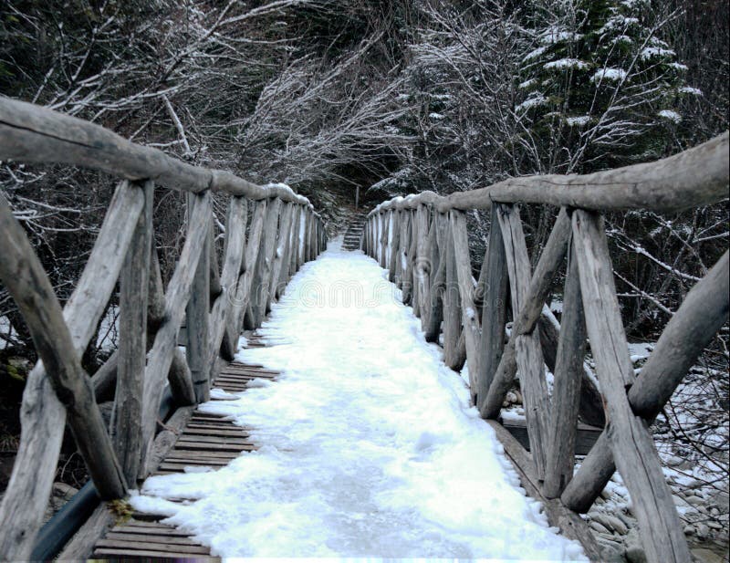 Wooden Bridge Covered with Snow Stock Photo - Image of path, mountain ...
