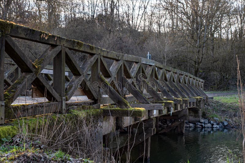 Old Wooden Bridge Over the River with Lots of Moss Stock Image - Image ...