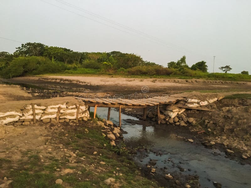 Old Wooden Bridge, River Crosses Underneath, View of the Sunrise Stock ...