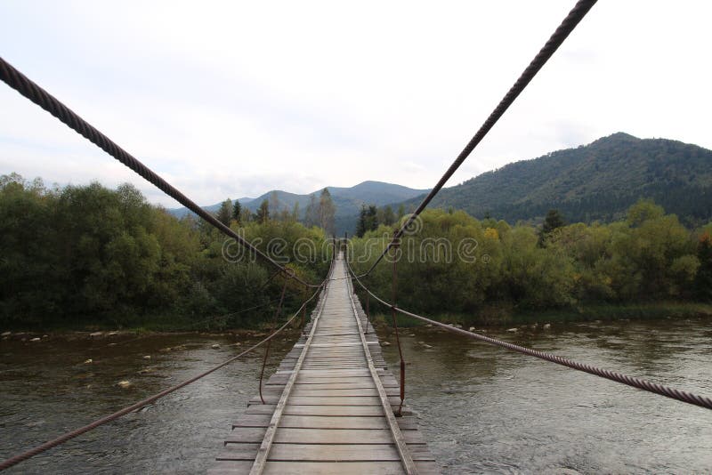 Old Wooden Bridge To the Green Forest Over the River Stock Image ...