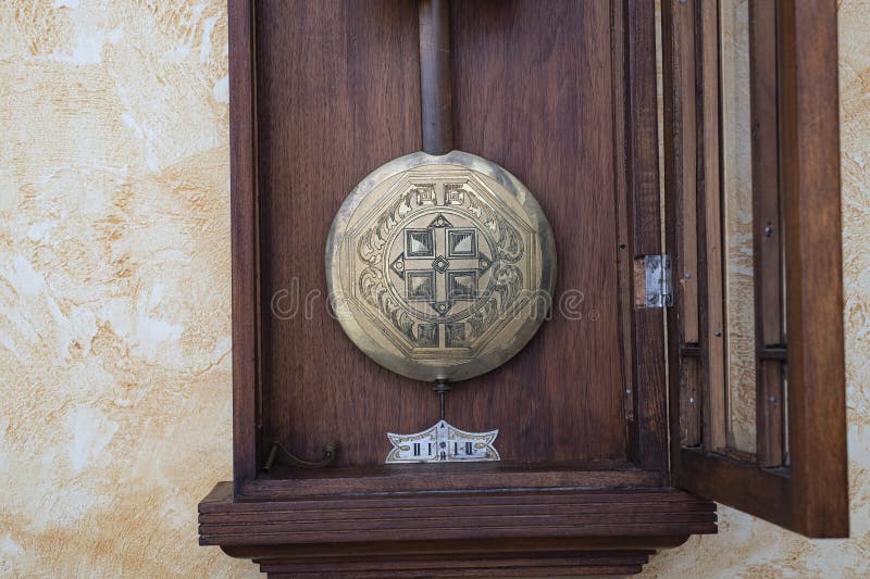 Old Wooden Clock with a Pendulum Hanging on Stock Image - Image of ...