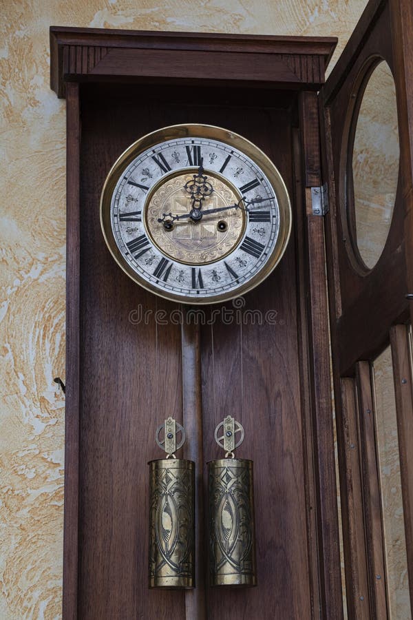 Old Wooden Clock with a Pendulum Hanging on Stock Image - Image of ...