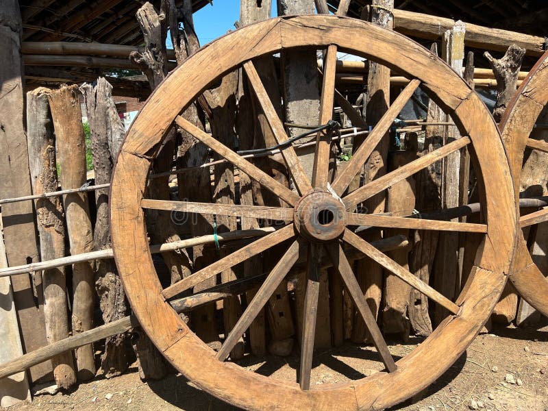 Old Wooden Decorative Wagon Wheel in a Barn Stock Image - Image of ...