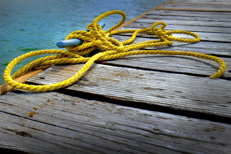 Old Wooden Dock by Water Yellow Rope Stock Image - Image of fixed ...