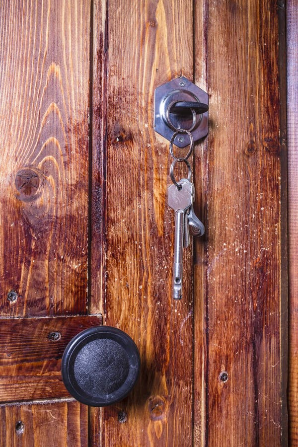 Old Wooden Door with Key Inserted in the Lock Stock Photo - Image of ...