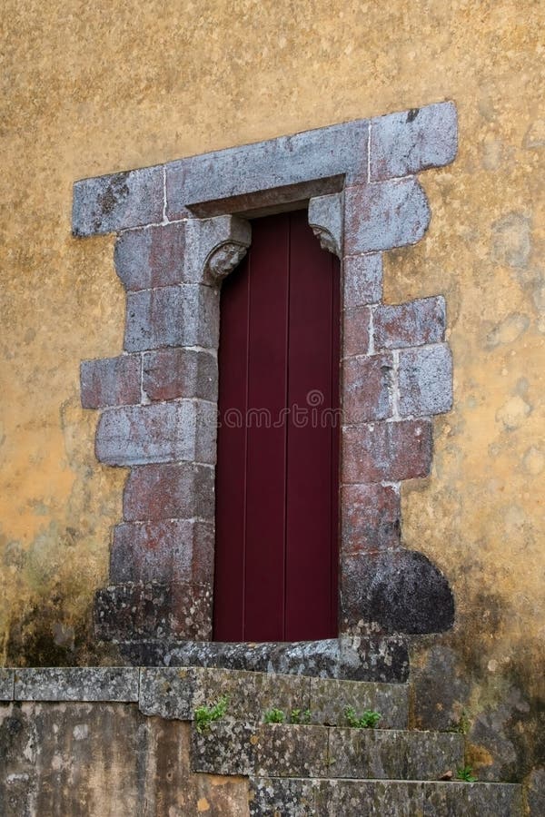 Old Wooden Door with Red Door in the Wall of Old House Stock Photo ...