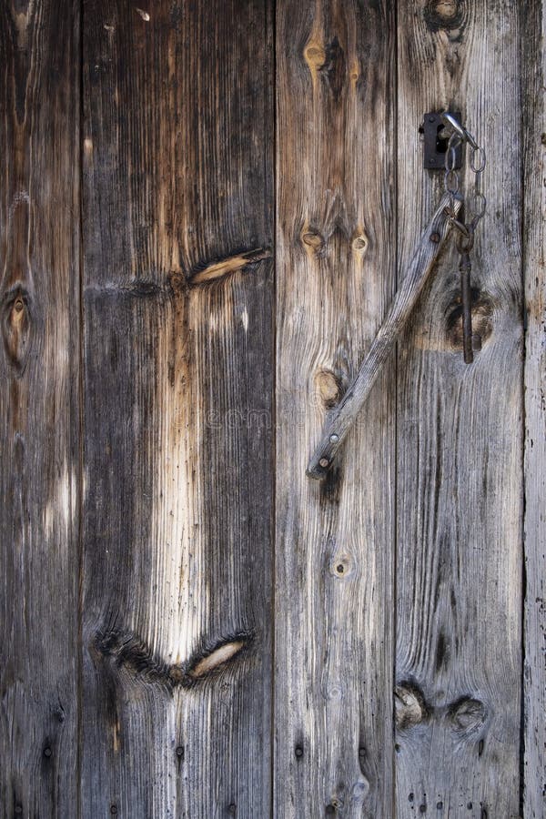 An Old Wooden Door, Weathered by the Passage of Time with an Antique ...