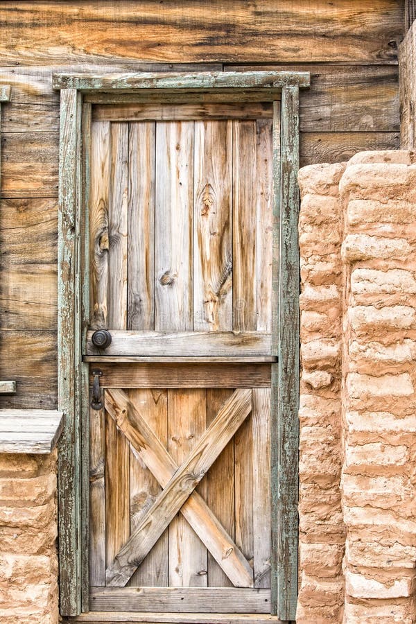 Old Western Door with Lantern in Front Stock Image - Image of spittoon ...