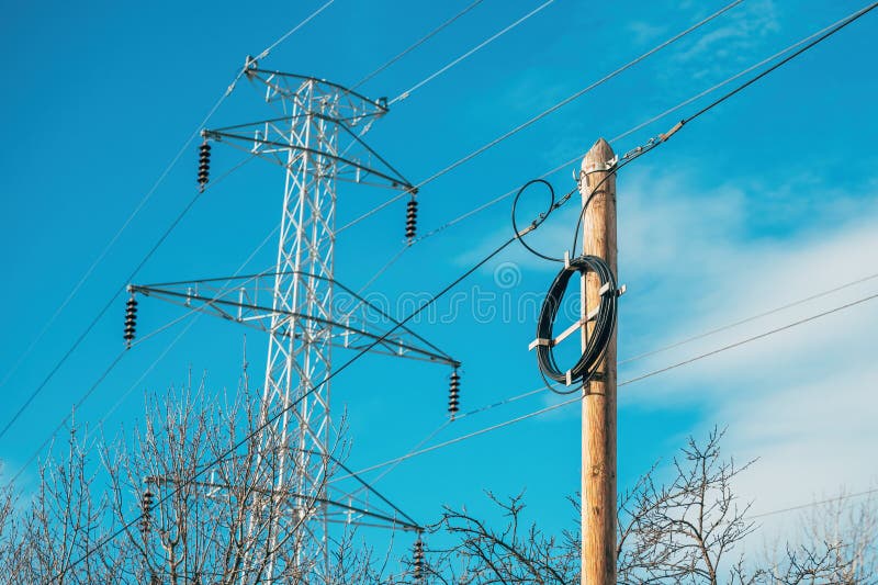 Old Wooden Electricity Pole and Overhead Powerline Tower Stock Photo ...