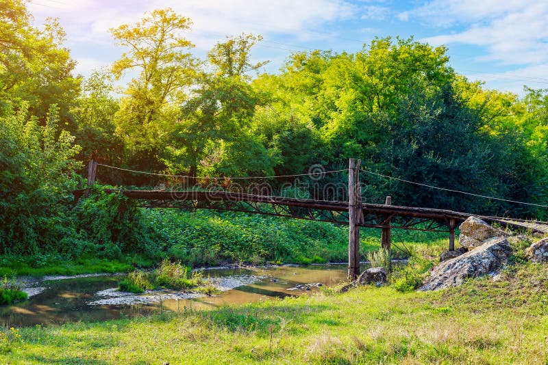 Old Wooden Footbridge Across the River. Background with Copy Space ...
