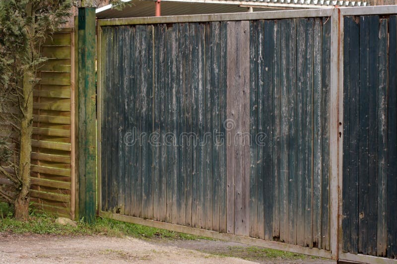 Old wooden gate of a house stock photo. Image of grass - 217671298