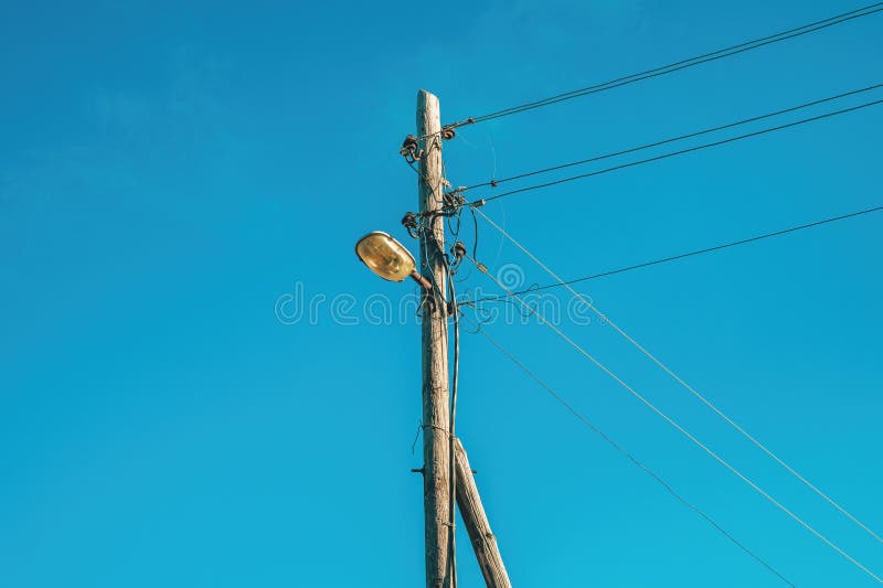 Old Wooden Lamp Post with Street Light and Electrical Wires Stock Photo ...