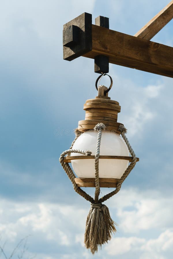 An Old Wooden Lantern Hanging on a Wooden Post Stock Image - Image of ...