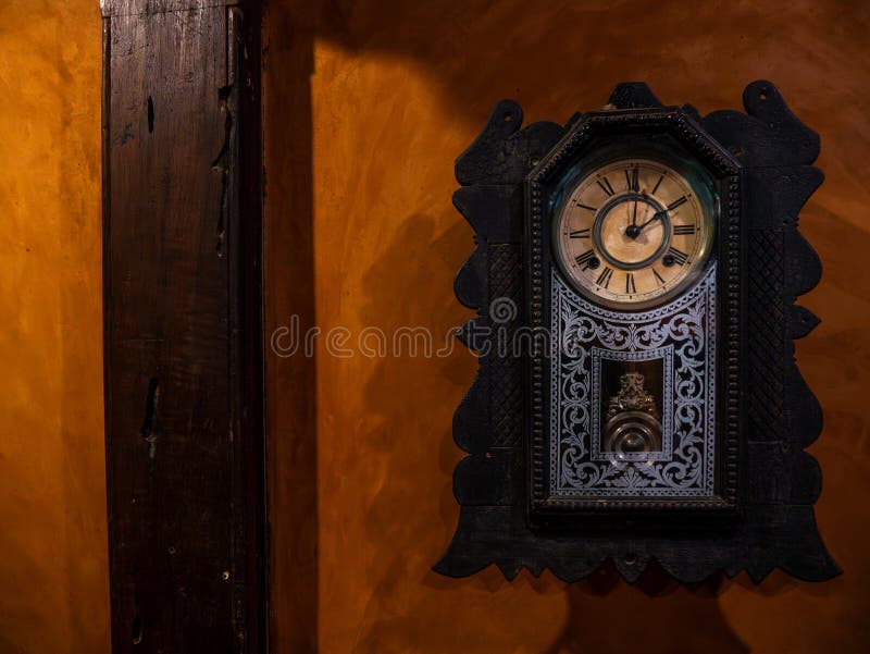 Old Wooden Pendulum Clock Hanging on a Wall Stock Photo - Image of ...
