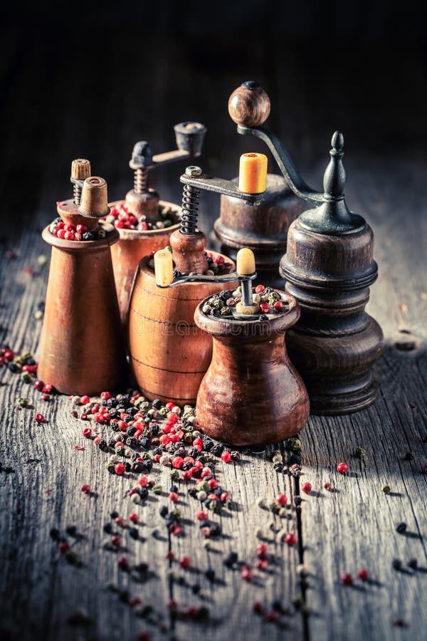 Old Wooden Pepper Mills with Different Types of Pepper Stock Photo ...