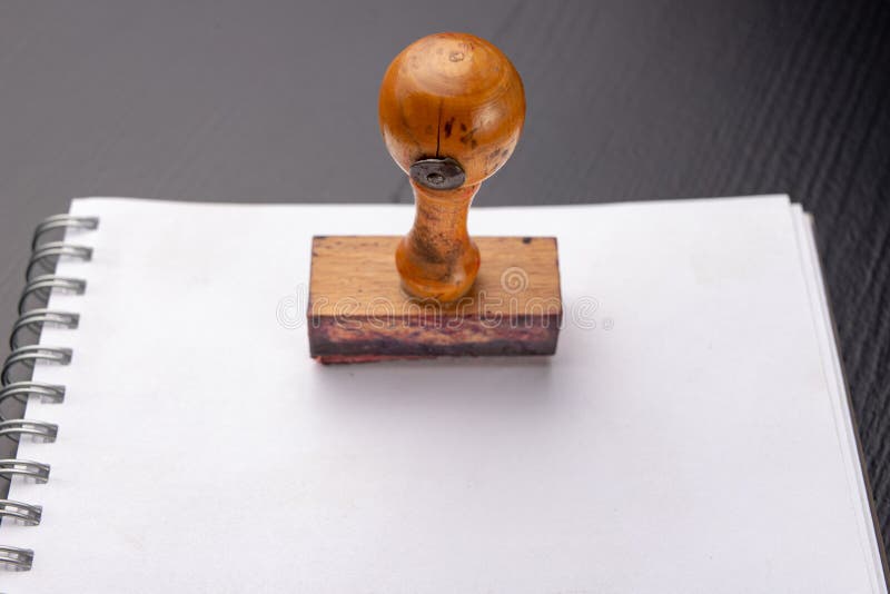 Old Wooden Rubber Stamp on a White Piece of Notebook. Office ...