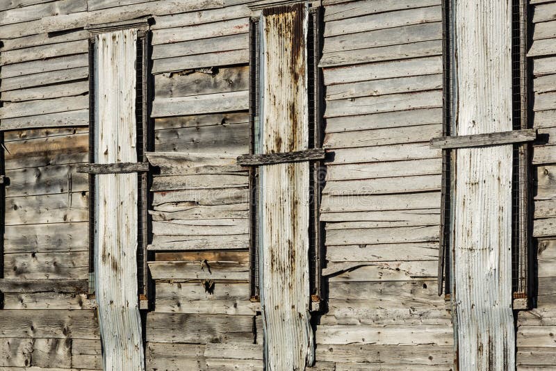 Old Wooden Siding of a Historic Structure with Its Windows Covered ...