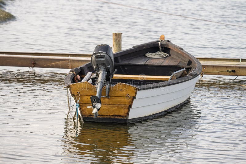 Old Wooden Small Boat with a Small Outboard Engine.. Stock Photo ...