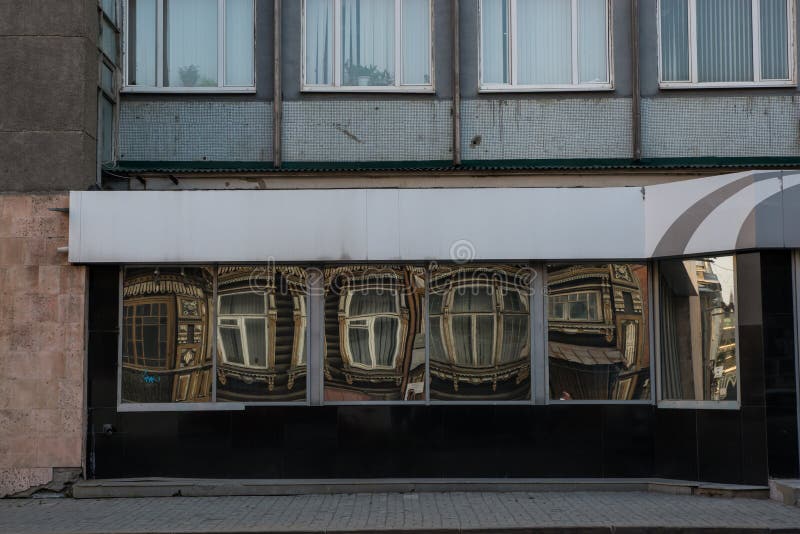 An Old Wooden Soviet Building with Mirrored Windows Stock Image - Image ...