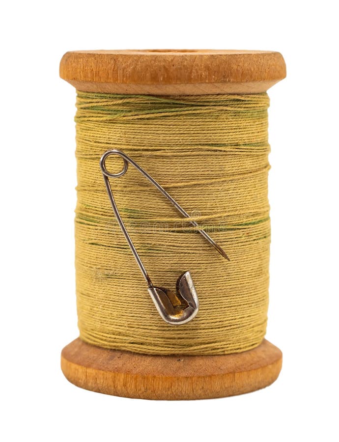 An Old Wooden Spool of Thread and a Needle on a White Background Close ...