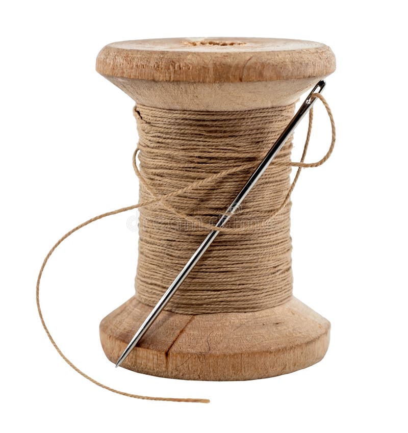 Old Wooden Spool of Thread and Needle on a White Background. Sewing ...