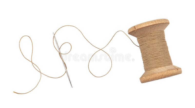 Old Wooden Spool of Thread and Needle on a White Background. Sewing ...