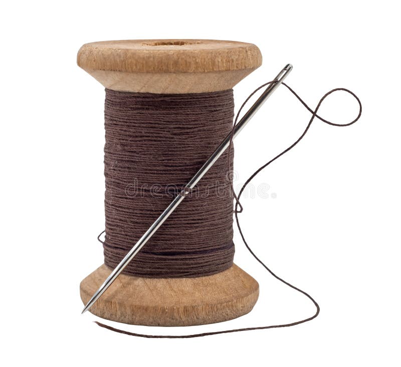 Old Wooden Spool of Thread and Needle on a White Background. Sewing ...