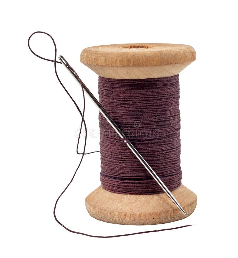 Old Wooden Spool of Thread and Needle on a White Background. Sewing ...