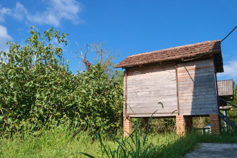 An Old Wooden Storage Hut in the Field Stock Image - Image of blue ...