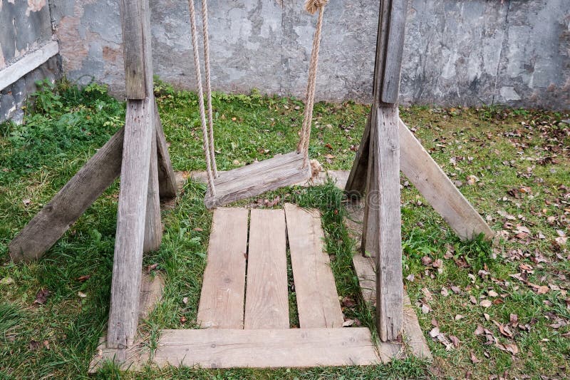 The Old Wooden Swing on the Ropes, the Courtyard House Stock Photo ...