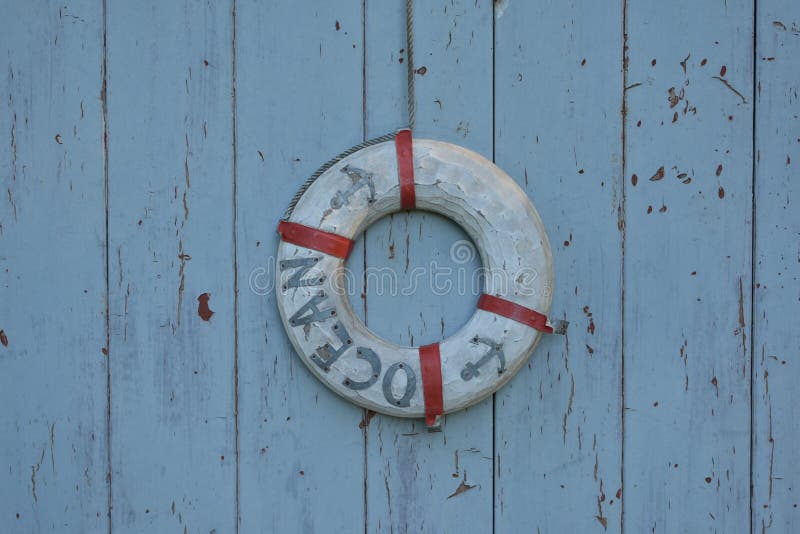 Old Wooden Texture with a Wooden Life Buoy White and Red Sea Float ...