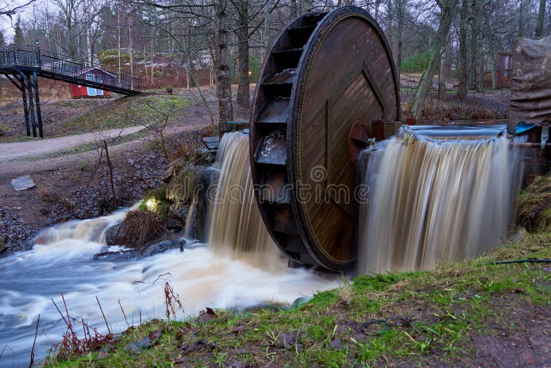 An Old Wooden Water Wheel on a Waterfall Stock Photo - Image of ...