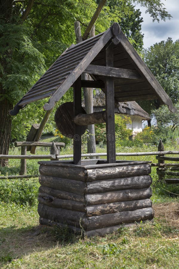 An Old Wooden Well is in a Small Village Stock Photo - Image of summer ...