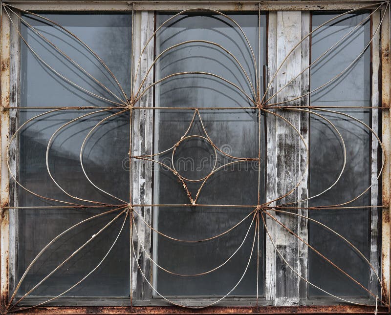 An Old Wooden Window with a Metal Grille. the Texture of the Window ...