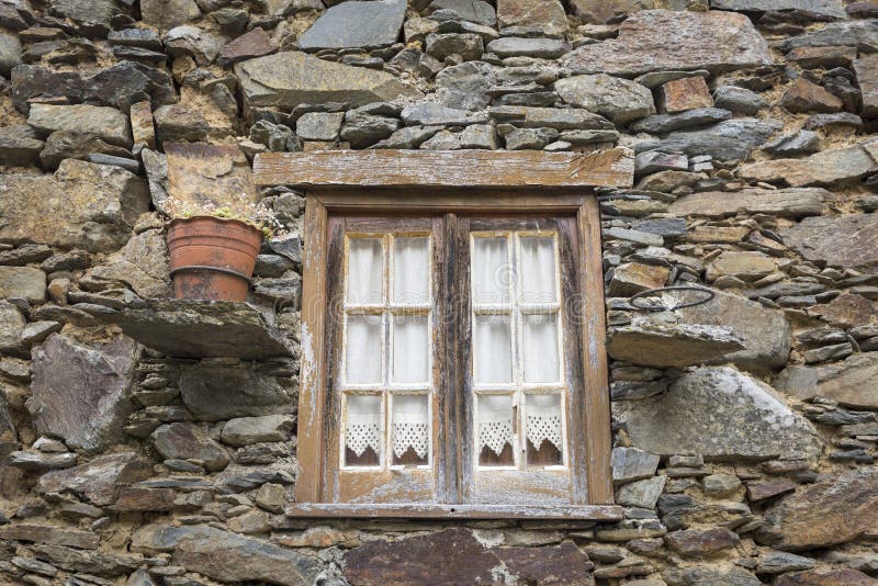 Old Wooden Window with Metallic Protection Bars on a Stone Made Wall ...