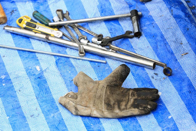 Old Work Gloves and Hammer in Workshop Stock Photo - Image of handyman ...