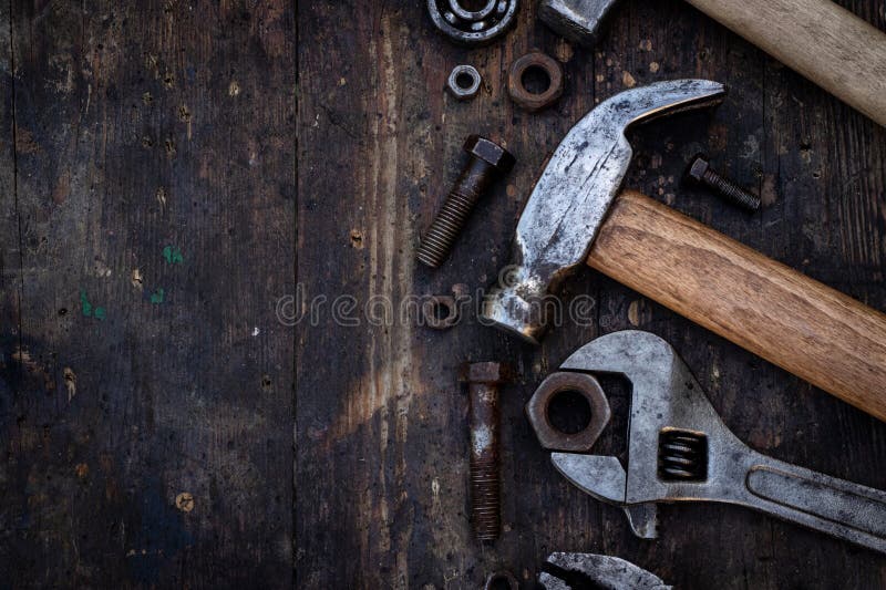 Old Work Tools Nuts, Bolts and Bearings Lie on a Wooden Workbench Stock ...